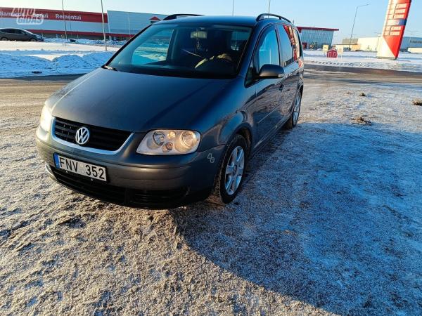 Grey Volkswagen Touran 2006 in Panevezys, with an engine capacity of 1.90 L and mileage of 310 thousand km for 1650 €, photo 1 on AUTOMOTO.COM.LV