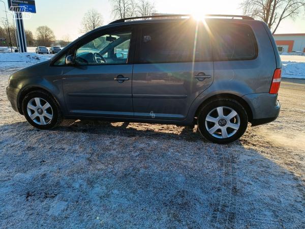 Grey Volkswagen Touran 2006 in Panevezys, with an engine capacity of 1.90 L and mileage of 310 thousand km for 1650 €, photo 6 on AUTOMOTO.COM.LV