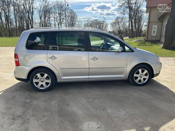 Grey Volkswagen Touran 2004 in Vilnius, with an engine capacity of 2.00 L and mileage of 283 thousand km for 1400 €, photo 8 on AUTOMOTO.COM.LV