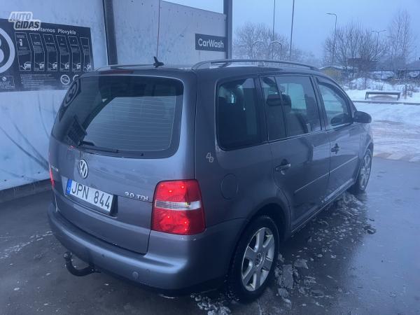 Grey Volkswagen Touran 2005 in Kaunas, with an engine capacity of 2.00 L and mileage of 308 thousand km for 1550 €, photo 3 on AUTOMOTO.COM.LV