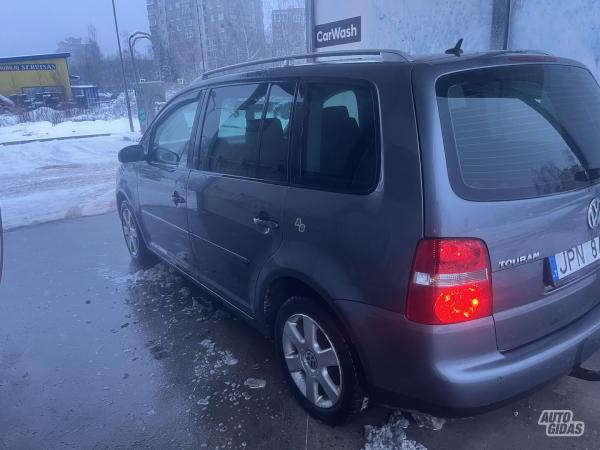 Grey Volkswagen Touran 2005 in Kaunas, with an engine capacity of 2.00 L and mileage of 308 thousand km for 1550 €, photo 5 on AUTOMOTO.COM.LV