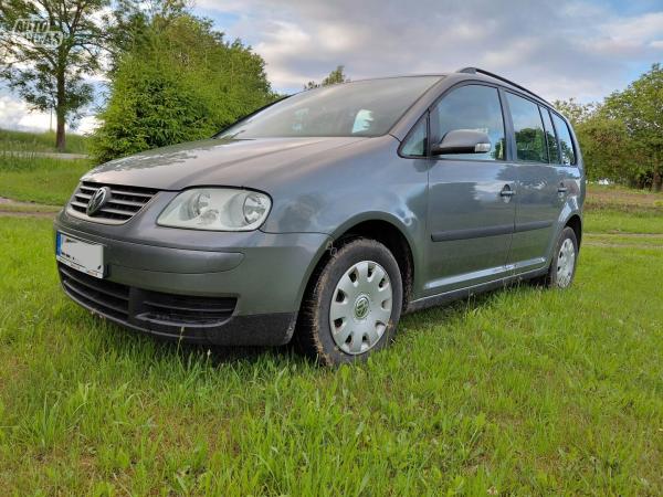 Grey Volkswagen Touran 2005 in Kelme, with an engine capacity of 1.90 L and mileage of 317 thousand km for 2250 €, photo 1 on AUTOMOTO.COM.LV