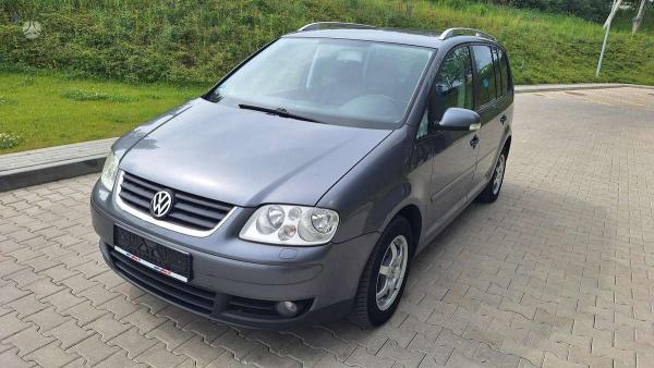 Grey Volkswagen Touran 2005 in Vilnius, with an engine capacity of 1.97 L and mileage of 238 thousand km for 2950 €, photo 2 on AUTOMOTO.COM.LV