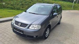 Grey Volkswagen Touran 2005 in Vilnius, with an engine capacity of 1.97 L and mileage of 238 thousand km for 2950 €, photo 3 on AUTOMOTO.COM.LV