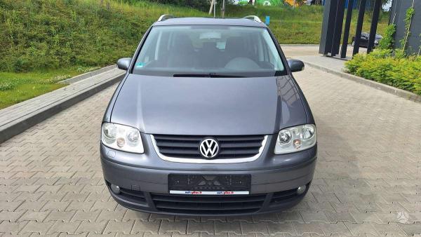 Grey Volkswagen Touran 2005 in Vilnius, with an engine capacity of 1.97 L and mileage of 238 thousand km for 2950 €, photo 3 on AUTOMOTO.COM.LV