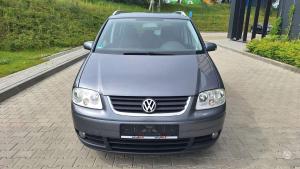 Grey Volkswagen Touran 2005 in Vilnius, with an engine capacity of 1.97 L and mileage of 238 thousand km for 2950 €, photo 4 on AUTOMOTO.COM.LV
