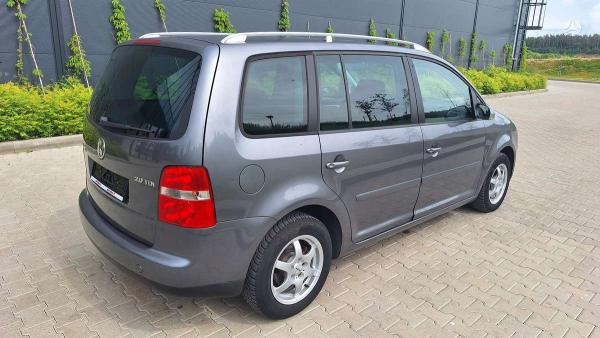 Grey Volkswagen Touran 2005 in Vilnius, with an engine capacity of 1.97 L and mileage of 238 thousand km for 2950 €, photo 7 on AUTOMOTO.COM.LV