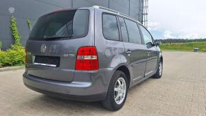 Grey Volkswagen Touran 2005 in Vilnius, with an engine capacity of 1.97 L and mileage of 238 thousand km for 2950 €, photo 39 on AUTOMOTO.COM.LV