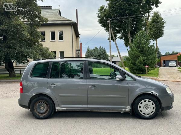Grey Volkswagen Touran 2005 in Panevezys, with an engine capacity of 2.00 L and mileage of 290 thousand km for 450 €, photo 5 on AUTOMOTO.COM.LV