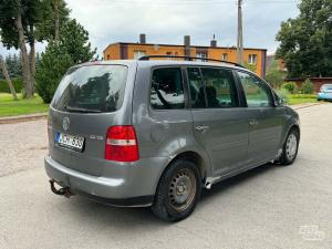 Grey Volkswagen Touran 2005 in Panevezys, with an engine capacity of 2.00 L and mileage of 290 thousand km for 450 €, photo 8 on AUTOMOTO.COM.LV