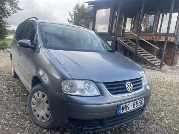 Grey Volkswagen Touran 2005 in Daugavpils, with an engine capacity of 1.90 L and mileage of 275 thousand km for 1300 €, photo 1 on AUTOMOTO.COM.LV