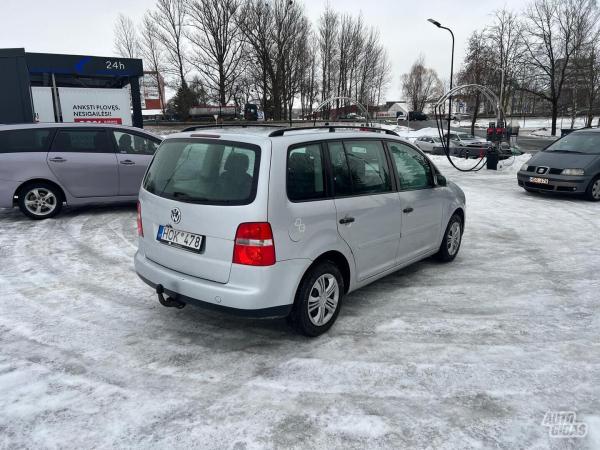 Grey Volkswagen Touran 2006 in Kaunas, with an engine capacity of 2.00 L and mileage of 12 thousand km for 1550 €, photo 4 on AUTOMOTO.COM.LV
