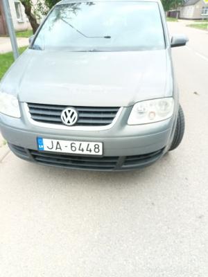 Pelēks Volkswagen Touran 2006 Daugavpils, ar dzinēja tilpumu 1.90 L un nobraukumu 205 tūkst. km par 1600 €, foto 10 vietnē AUTOMOTO.COM.LV
