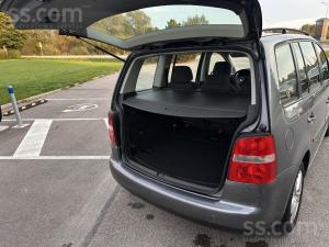 Grey Volkswagen Touran 2006 in Liepaja, with an engine capacity of 1.90 L and mileage of 227 thousand km for 2400 €, photo 15 on AUTOMOTO.COM.LV
