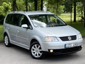 Grey Volkswagen Touran 2007 in Kaunas, with an engine capacity of 2.00 L and mileage of 262 thousand km for 1650 €, photo  on AUTOMOTO.COM.LV