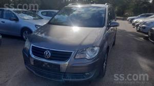 Grey Volkswagen Touran 2007 in Riga, with an engine capacity of 1.90 L and mileage of 248 thousand km for 2100 €, photo 4 on AUTOMOTO.COM.LV