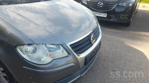 Grey Volkswagen Touran 2007 in Riga, with an engine capacity of 1.90 L and mileage of 248 thousand km for 2100 €, photo 12 on AUTOMOTO.COM.LV