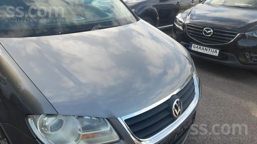 Grey Volkswagen Touran 2007 in Riga, with an engine capacity of 1.90 L and mileage of 248 thousand km for 2100 €, photo 14 on AUTOMOTO.COM.LV