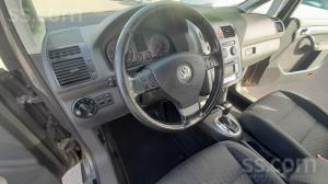 Grey Volkswagen Touran 2007 in Riga, with an engine capacity of 1.90 L and mileage of 248 thousand km for 2100 €, photo 17 on AUTOMOTO.COM.LV