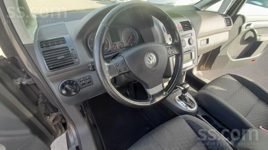 Grey Volkswagen Touran 2007 in Riga, with an engine capacity of 1.90 L and mileage of 248 thousand km for 2100 €, photo 17 on AUTOMOTO.COM.LV