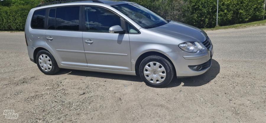 Grey Volkswagen Touran 2007 in Utena, with an engine capacity of 2.00 L and mileage of 255 thousand km for 3450 €, photo 19 on AUTOMOTO.COM.LV