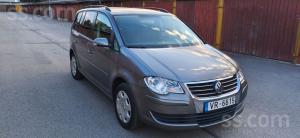 Grey Volkswagen Touran 2007 in Riga, with an engine capacity of 1.90 L and mileage of 311 thousand km for 2400 €, photo  on AUTOMOTO.COM.LV