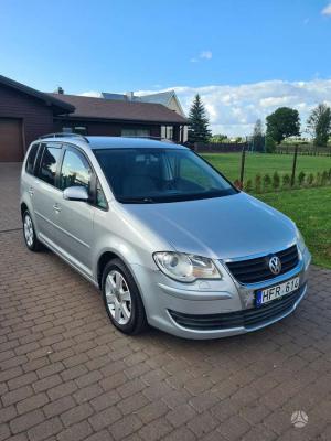 Grey Volkswagen Touran 2007 in Kaisiadorys, with an engine capacity of 1.97 L and mileage of 319 thousand km for 2649 €, photo  on AUTOMOTO.COM.LV