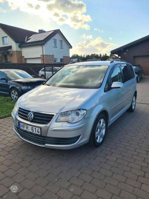 Grey Volkswagen Touran 2007 in Kaisiadorys, with an engine capacity of 1.97 L and mileage of 319 thousand km for 2649 €, photo 3 on AUTOMOTO.COM.LV