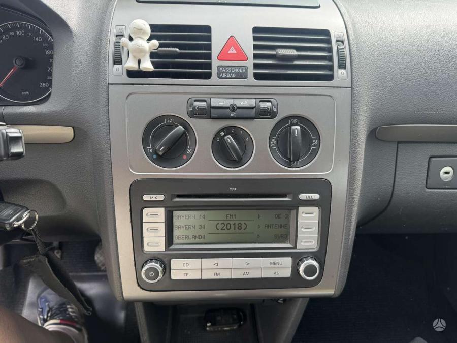 Grey Volkswagen Touran 2007 in Marijampole, with an engine capacity of 1.90 L and mileage of 355 thousand km for 2150 €, photo 16 on AUTOMOTO.COM.LV