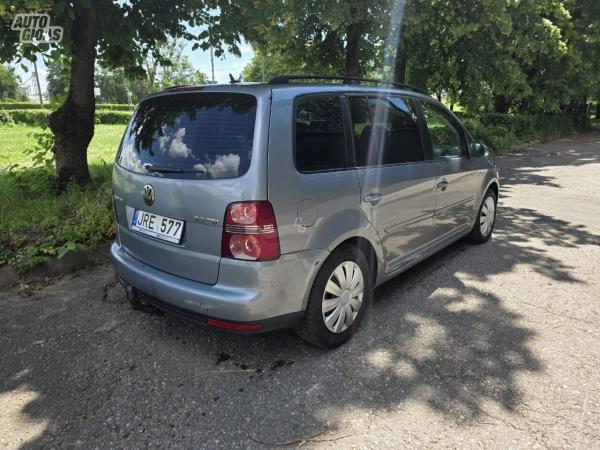 Grey Volkswagen Touran 2008 in Kaunas, with an engine capacity of 2.00 L and mileage of 245 thousand km for 1600 €, photo 4 on AUTOMOTO.COM.LV
