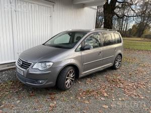 Grey Volkswagen Touran 2009 in Riga, with an engine capacity of 1.90 L and mileage of 248 thousand km for 2500 €, photo  on AUTOMOTO.COM.LV