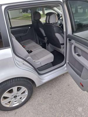Grey Volkswagen Touran 2009 in Skuodas, with an engine capacity of 1.97 L and mileage of 320 thousand km for 2700 €, photo 6 on AUTOMOTO.COM.LV