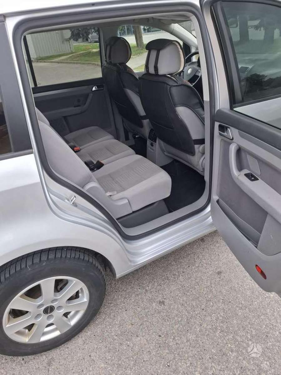 Grey Volkswagen Touran 2009 in Skuodas, with an engine capacity of 1.97 L and mileage of 320 thousand km for 2700 €, photo 6 on AUTOMOTO.COM.LV