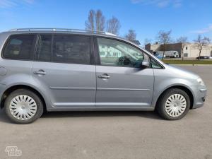 Grey Volkswagen Touran 2010 in Panevezys, with an engine capacity of 2.00 L and mileage of 204 thousand km for 3500 €, photo 4 on AUTOMOTO.COM.LV