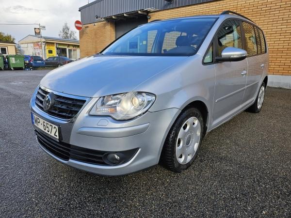 Grey Volkswagen Touran 2010 in Riga, with an engine capacity of 1.90 L and mileage of 318 thousand km for 3950 €, photo 1 on AUTOMOTO.COM.LV