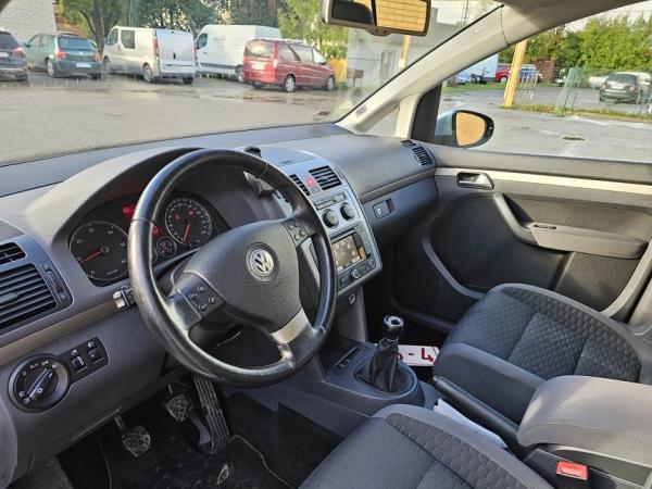 Grey Volkswagen Touran 2010 in Riga, with an engine capacity of 1.90 L and mileage of 318 thousand km for 3950 €, photo 6 on AUTOMOTO.COM.LV
