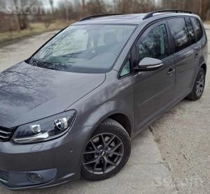 Pelēks Volkswagen Touran 2011 Rīga, ar dzinēja tilpumu 2.00 L un nobraukumu 240 tūkst. km par 7200 €, foto 5 vietnē AUTOMOTO.COM.LV