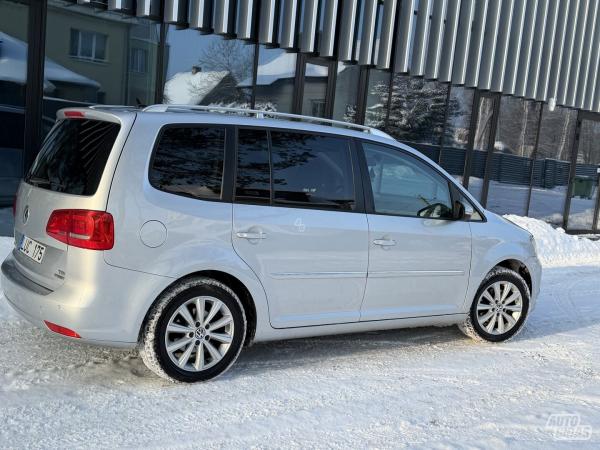 Grey Volkswagen Touran 2011 in Kaunas, with an engine capacity of 1.20 L and mileage of 215 thousand km for 4390 €, photo 2 on AUTOMOTO.COM.LV