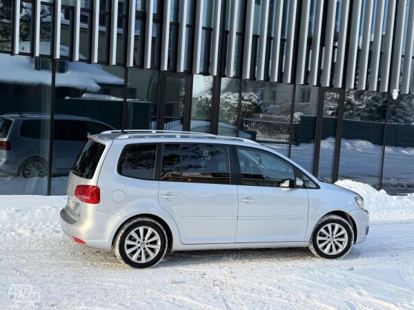 Grey Volkswagen Touran 2011 in Kaunas, with an engine capacity of 1.20 L and mileage of 215 thousand km for 4399 €, photo 4 on AUTOMOTO.COM.LV