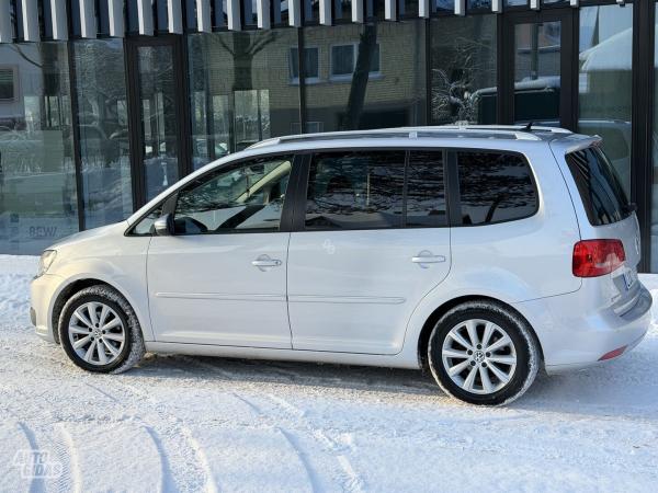 Grey Volkswagen Touran 2011 in Kaunas, with an engine capacity of 1.20 L and mileage of 215 thousand km for 4399 €, photo 6 on AUTOMOTO.COM.LV