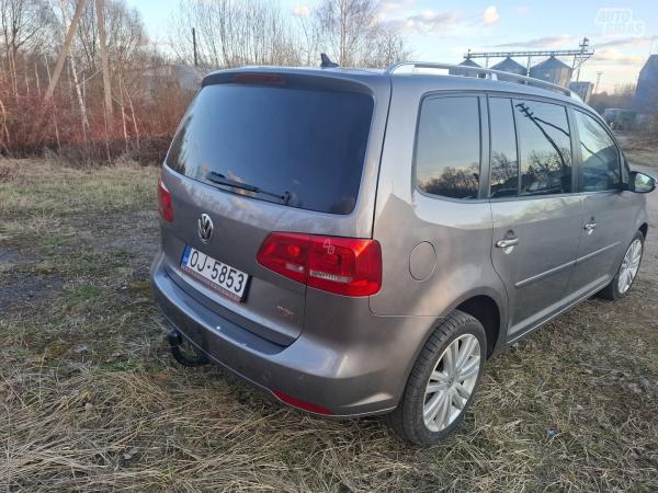 Grey Volkswagen Touran 2011 in Kupiskis, with an engine capacity of 2.00 L and mileage of 225 thousand km for 5350 €, photo 5 on AUTOMOTO.COM.LV