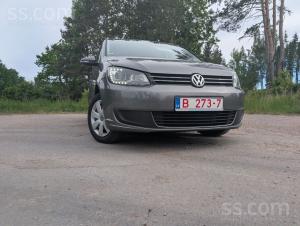 Grey Volkswagen Touran 2011 in Riga, with an engine capacity of 1.40 L and mileage of 194 thousand km for 5700 €, photo 3 on AUTOMOTO.COM.LV