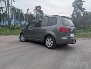 Grey Volkswagen Touran 2011 in Riga, with an engine capacity of 1.40 L and mileage of 194 thousand km for 5700 €, photo 14 on AUTOMOTO.COM.LV