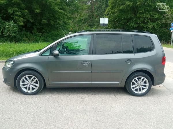Grey Volkswagen Touran 2011 in Vilnius, with an engine capacity of 1.60 L and mileage of 310 thousand km for 4890 €, photo 6 on AUTOMOTO.COM.LV