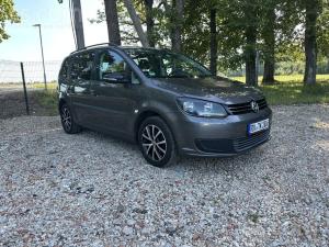 Grey Volkswagen Touran 2011 in Cesis, with an engine capacity of 1.60 L and mileage of 0 thousand km for 6800 €, photo  on AUTOMOTO.COM.LV