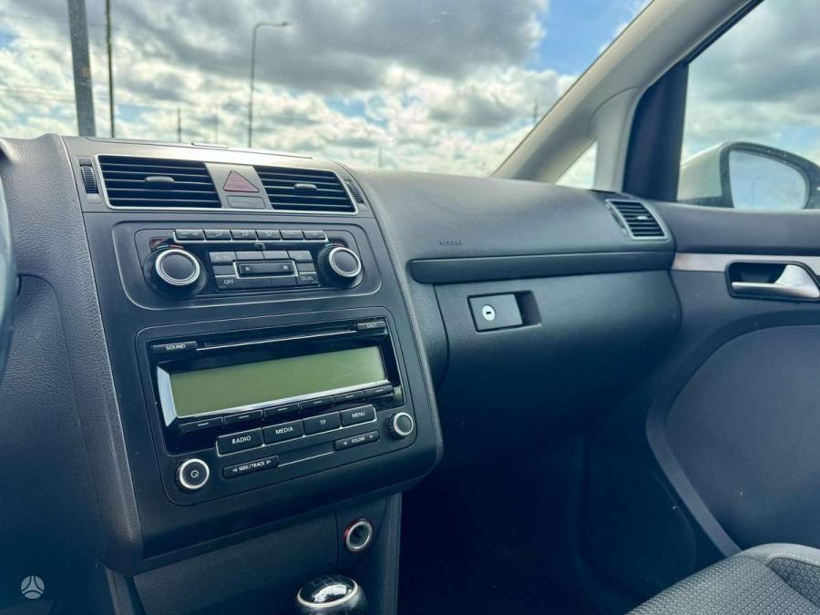 Grey Volkswagen Touran 2011 in Panevezys, with an engine capacity of 1.20 L and mileage of 305 thousand km for 2499 €, photo 12 on AUTOMOTO.COM.LV