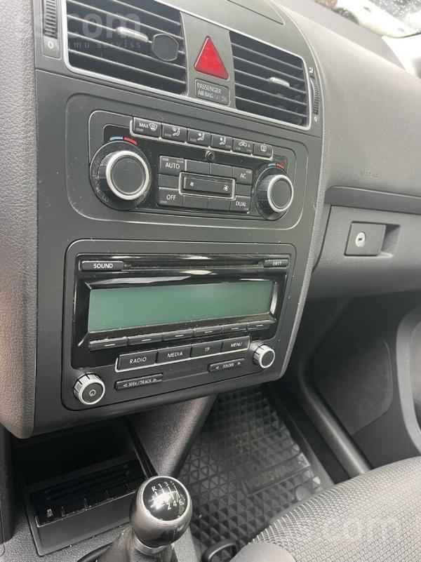Grey Volkswagen Touran 2011 in Riga, with an engine capacity of 2.00 L and mileage of 225 thousand km for 6550 €, photo 9 on AUTOMOTO.COM.LV