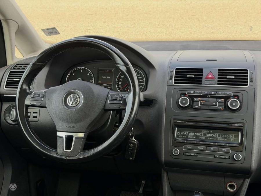 Grey Volkswagen Touran 2011 in Taurage, with an engine capacity of 1.97 L and mileage of 300 thousand km for 5990 €, photo 14 on AUTOMOTO.COM.LV