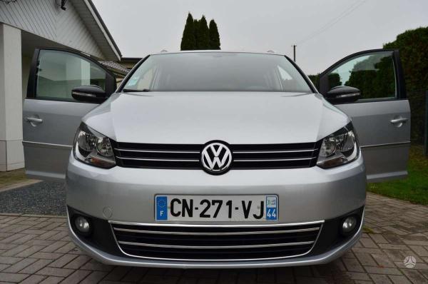 Grey Volkswagen Touran 2013 in Kaunas, with an engine capacity of 2.00 L and mileage of 230 thousand km for 6650 €, photo 6 on AUTOMOTO.COM.LV