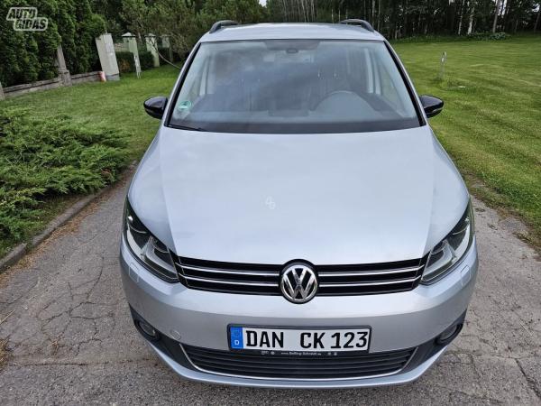 Grey Volkswagen Touran 2013 in Mazeikiai, with an engine capacity of 2.00 L and mileage of 242 thousand km for 5950 €, photo 5 on AUTOMOTO.COM.LV